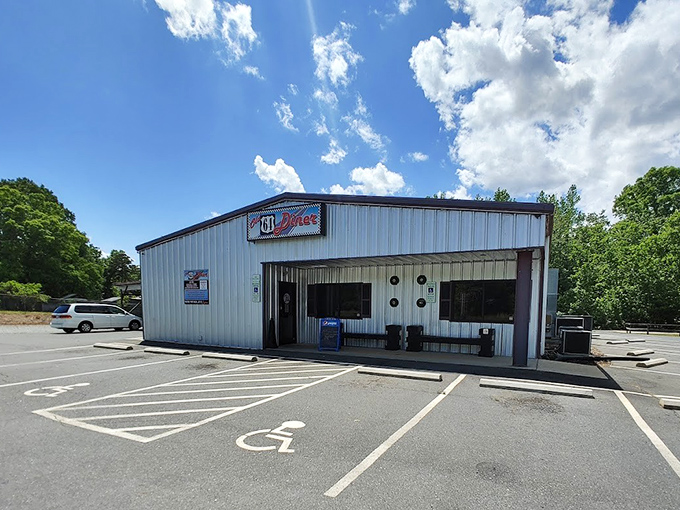 The classic checkered border sign beckons like a time portal to the 1950s. No DeLorean required for this journey back in time. 