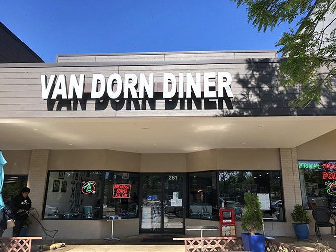The retro signage beckons like a time machine with a lunch special. Van Dorn Diner's exterior promises a journey back to when calories didn't count and jukeboxes ruled.