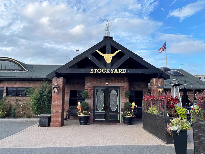 The grand entrance beckons with its iconic golden longhorn skull, promising carnivorous delights within those brick walls. Massachusetts hospitality with a Texas accent. 