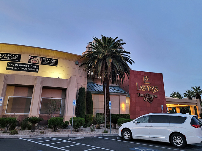 The unassuming exterior of Lawry's The Prime Rib stands like a calm oasis amid Vegas's neon storms. Palm trees welcome you to this temple of meat.