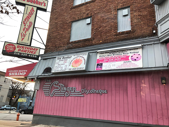 The neon-pink beacon of Sid Booker's illuminates the Philadelphia night like a seafood lighthouse, calling hungry travelers home to shrimp paradise.