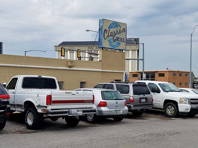 The unassuming white exterior of Classen Grill proves once again that culinary treasures often hide in plain sight at busy Oklahoma City intersections.