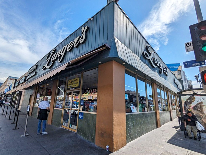 The iconic mint-green exterior of Langer's stands proudly at 7th and Alvarado, a beacon of pastrami perfection since 1947.