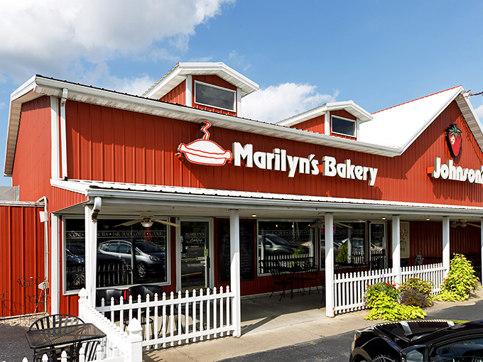 The iconic red building with its white picket fence and hanging ferns makes promises that the bakers inside absolutely keep. 
