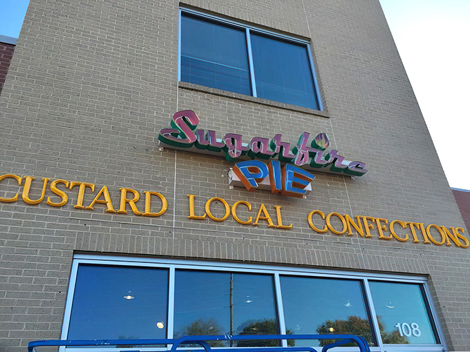 The colorful Sugarfire Pie sign promises "Custard Local Confections" &ndash; a beacon of sweetness in Olivette that delivers on every sugary syllable.