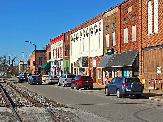 Downtown Spencer's historic storefronts and railroad tracks create that perfect small-town tableau where time seems to slow down just enough to notice life's details.