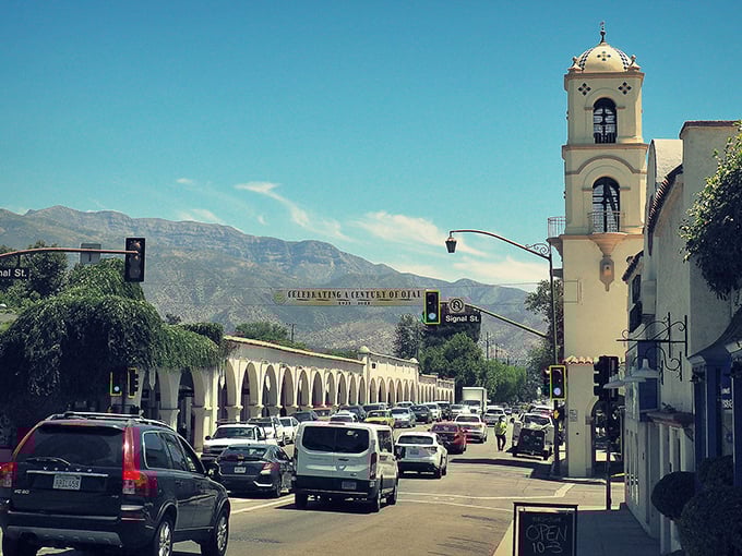 Downtown Ojai welcomes visitors with its iconic bell tower and Spanish Colonial architecture, framed by the majestic Topatopa Mountains that create the valley's famous "pink moment" at sunset.