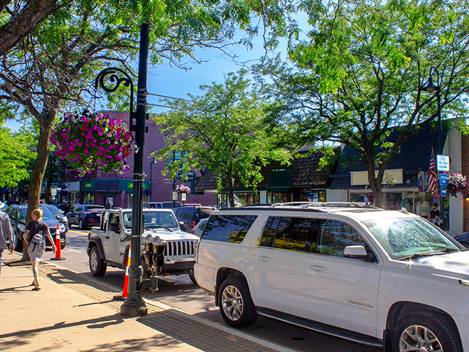 Downtown Charlevoix beckons with its charming storefronts and blue awnings, where Simonsen's Bakery promises sweet treasures worth every calorie.