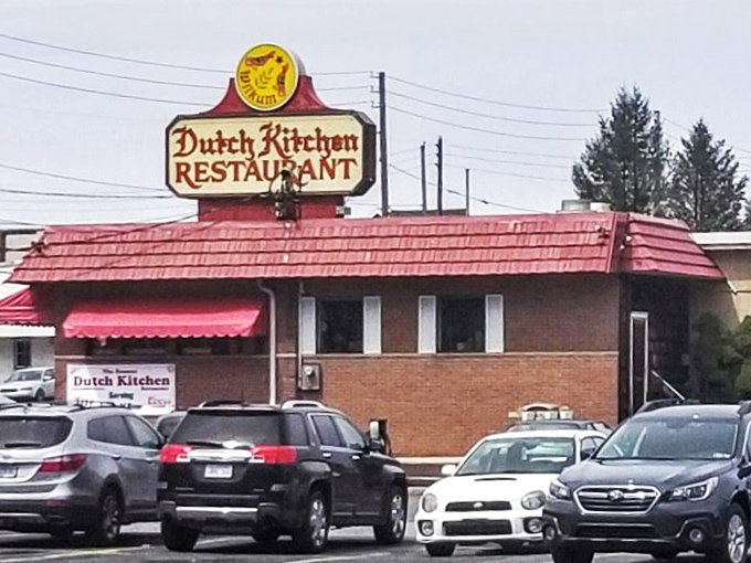 The red-roofed sanctuary of comfort food stands proudly on Route 61, its vintage sign and hex symbol beckoning hungry travelers like a Pennsylvania Dutch lighthouse.