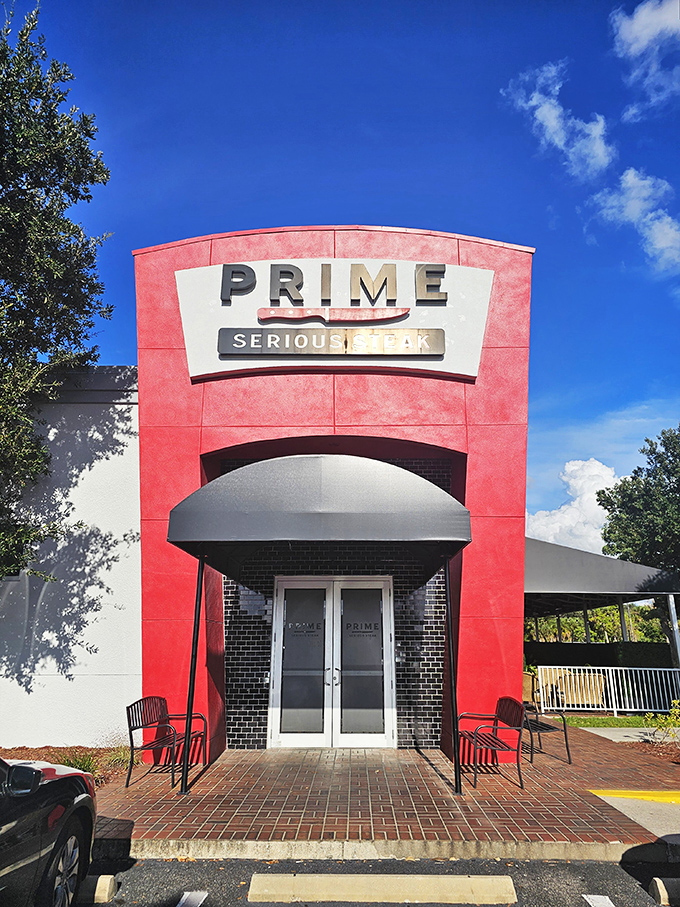 The bold red exterior doesn't whisper, it announces: "Serious steak happens here." This architectural meat manifesto in Port Charlotte means business.