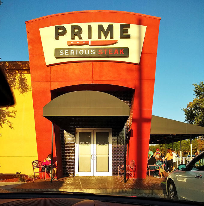 The bold red exterior doesn't whisper, it announces: "Serious steak happens here." This architectural meat manifesto in Port Charlotte means business.