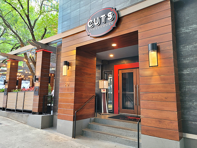 The unassuming exterior of Cuts Steakhouse belies the culinary magic happening inside. Like finding a diamond in downtown Atlanta's concrete jungle.