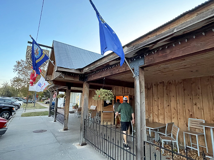 Rustic charm meets meat-lovers' paradise at this unassuming wooden storefront. The Kansas flag flutters overhead like a beacon for hungry travelers.