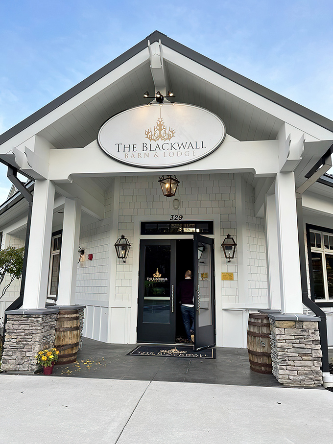 The white farmhouse exterior promises culinary magic within, like finding a surprise gift wrapped in architectural charm.