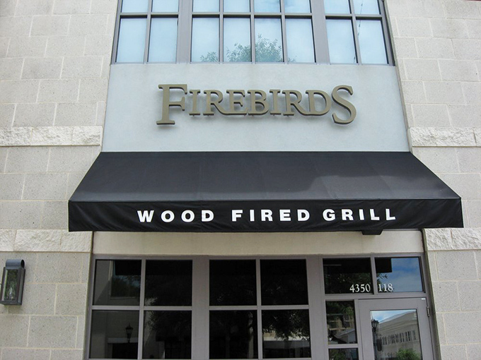 The blue glow of Firebirds beckons like a lighthouse for the hungry. At night, its warm exterior promises culinary adventures await inside.