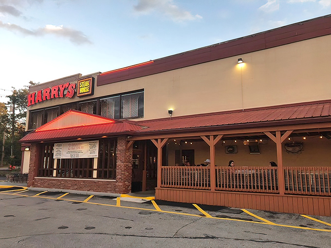 Harry's bold red signage stands like a beacon for hungry travelers, promising steak salvation in an unassuming strip mall setting.