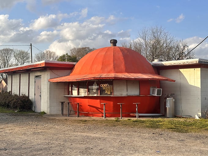 The giant orange dome isn't a mirage—it's architectural whimsy serving up comfort food. Like finding a citrus spaceship that decided to land in Redfield and start flipping pancakes.