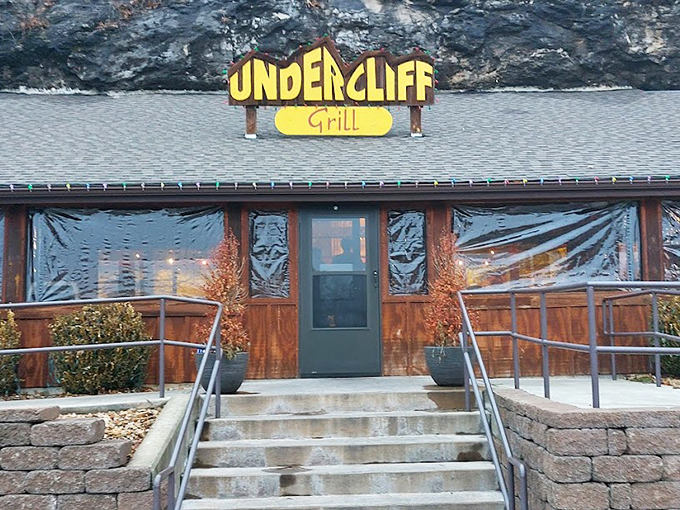 Where geology meets gastronomy! Undercliff Grill & Bar nestles against a towering limestone cliff, creating perhaps Missouri's most dramatic restaurant backdrop.