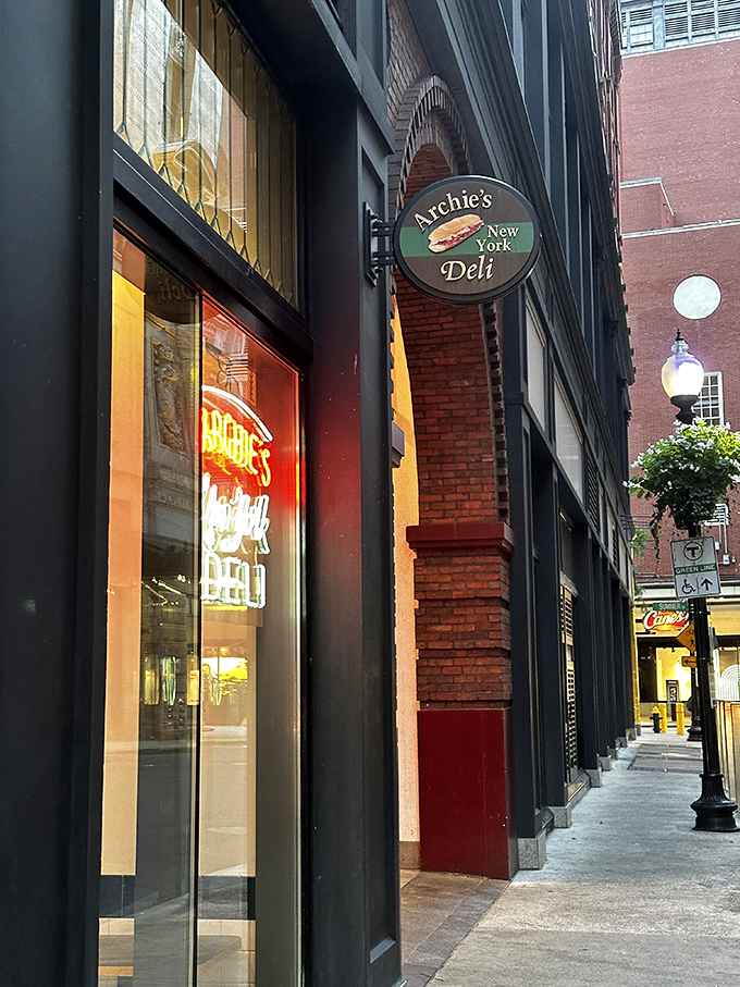 The iconic Archie's sign beckons sandwich pilgrims with its simple promise: authentic New York deli fare in the heart of Boston