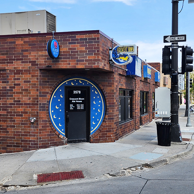 The iconic blue crescent moon entrance beckons like a portal to comfort food nirvana. Brick, beer, and the promise of Nebraska's best Reuben await.