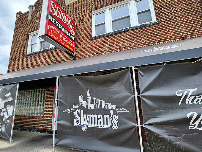The brick facade of Slyman's proudly announces its mission with that iconic red sign: "Home of the Biggest Corned Beef Sandwiches." Consider yourself warned&mdash;and enticed.