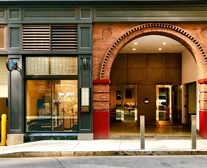 The iconic Archie's sign beckons sandwich pilgrims with its simple promise: authentic New York deli fare in the heart of Boston.