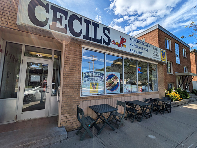 Welcome to Cecil's, where the neon sign promises delicatessen delights and the brick facade holds decades of delicious secrets!