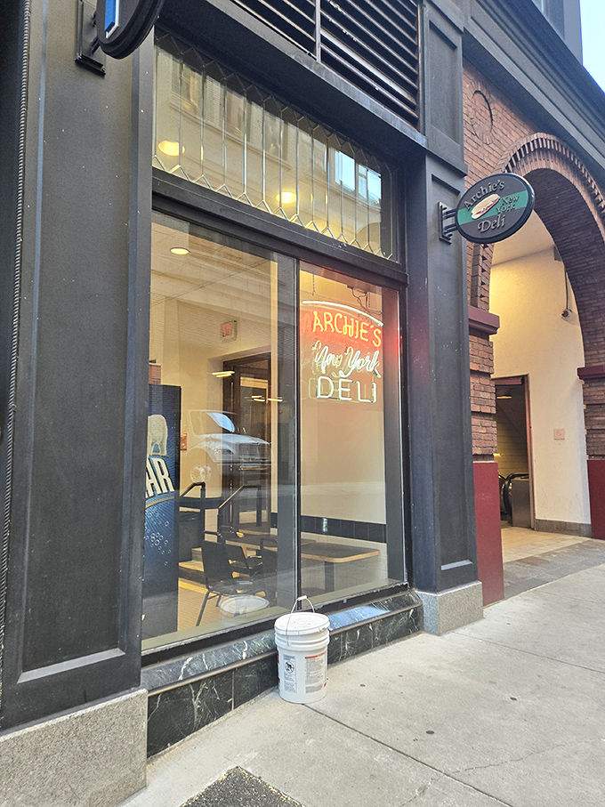 The iconic Archie's sign beckons sandwich pilgrims with its simple promise: authentic New York deli fare in the heart of Boston.
