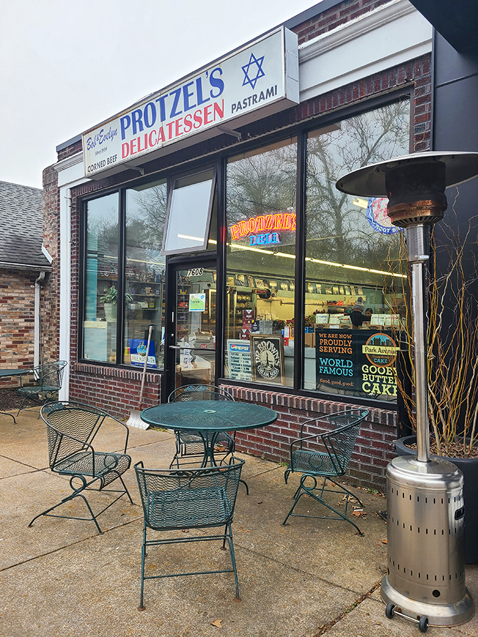 The unassuming storefront of Protzel's Delicatessen stands like a time portal to sandwich nirvana, complete with outdoor seating for those perfect St. Louis afternoons.