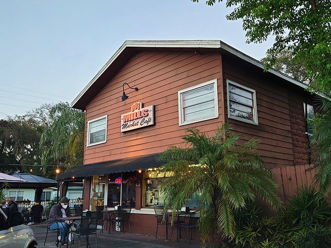 The rustic wooden exterior of 903 Mills Market beckons like an old friend, promising comfort food and zero pretension in Orlando's Mills 50 district.