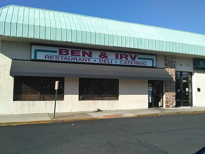 The unassuming exterior of Ben & Irv's hides culinary treasures within. That teal roof has sheltered sandwich seekers for generations.
