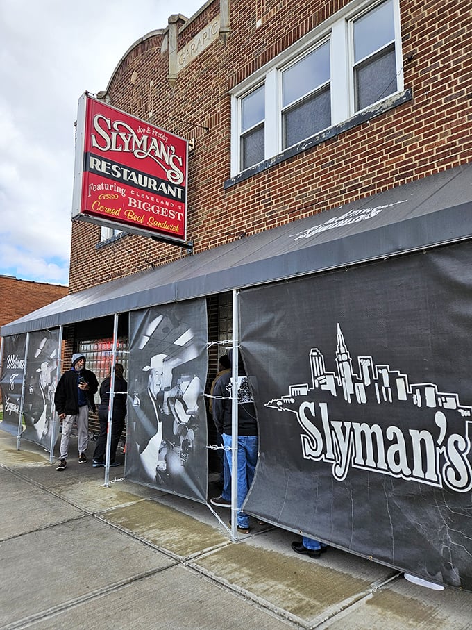 The brick facade of Slyman's proudly announces its mission with that iconic red sign: "Home of the Biggest Corned Beef Sandwiches." Consider yourself warned—and enticed.