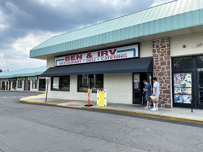 The unassuming exterior of Ben & Irv's hides culinary treasures within. That teal roof has sheltered sandwich seekers for generations. 