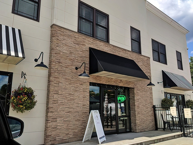 The unassuming exterior of Olive Tree Cafe hides culinary treasures within, like finding a diamond in your backyard. That neon "OPEN" sign is your invitation to flavor paradise.