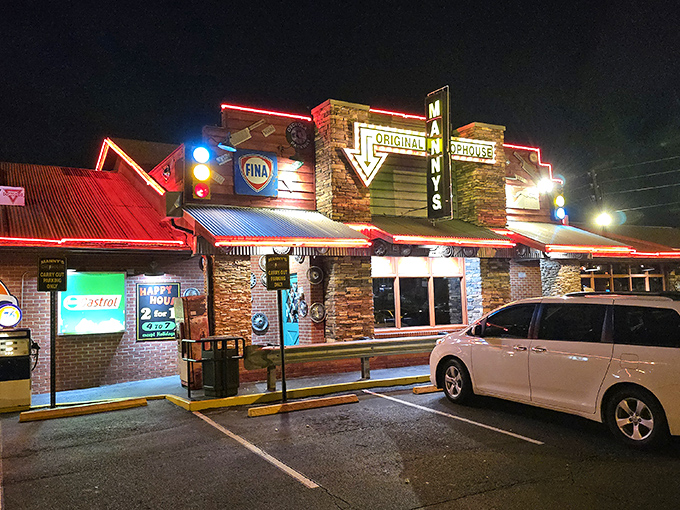 The neon-lit exterior of Manny's Original Chophouse stands like a beacon for carnivores, promising "LOVE at First Bite" beneath its iconic signage. 