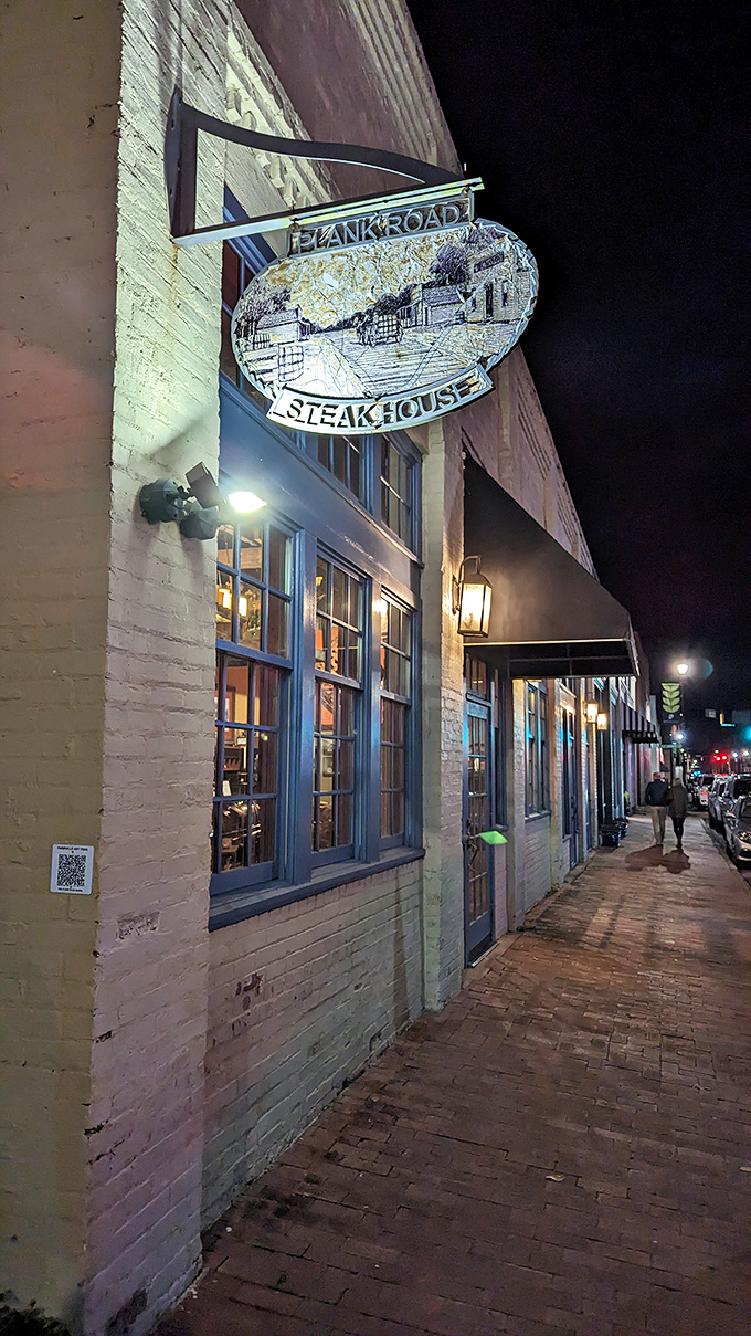 The unassuming yellow brick exterior of Plank Road Steak House hides culinary treasures within, like a delicious secret waiting to be discovered.