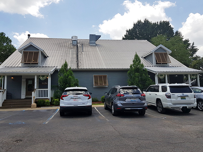 This charming building nestled among the trees houses a welcoming sports bar perfect for game day gatherings.