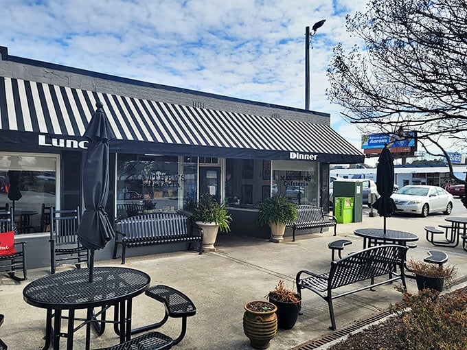 The unassuming exterior of Matthews Cafeteria stands like a time capsule on Tucker's Main Street, promising comfort food that transcends decades.