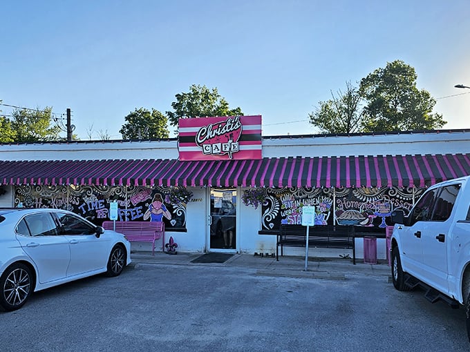 The pink and black striped awning of Christi's Cafe isn't playing hard to get—this bold Louisville landmark announces itself with unapologetic charm and confidence.