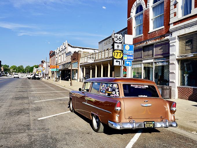 The road stretches toward infinity, where Kansas sky meets prairie in a perfect horizon. This is freedom defined.