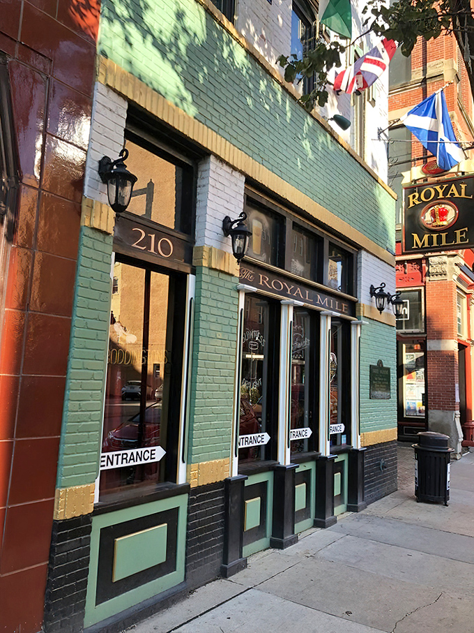 The mint-green facade of The Royal Mile stands out in downtown Des Moines like a British flag at an Iowa corn festival. 