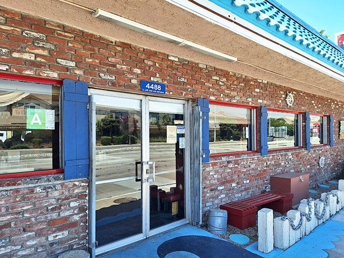 The turquoise roof of Shrimp House stands out like a maritime beacon in suburban Arcadia, promising seafood treasures within its humble brick walls.