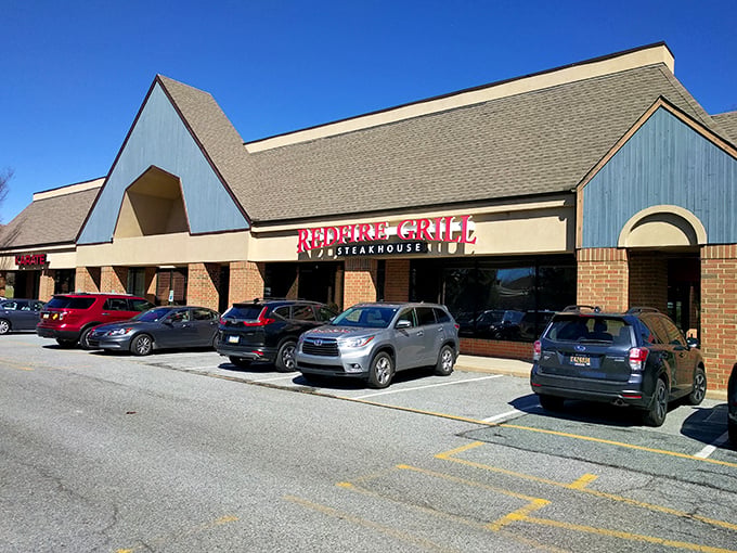 The unassuming exterior of Redfire Grill & Steakhouse proves once again that the best culinary treasures often hide in plain sight.