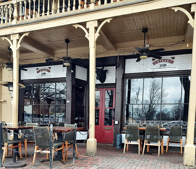 Historic charm meets culinary excellence at Little Alley's Roswell location. The two-story building's classic Southern architecture beckons like an old friend with a delicious secret.