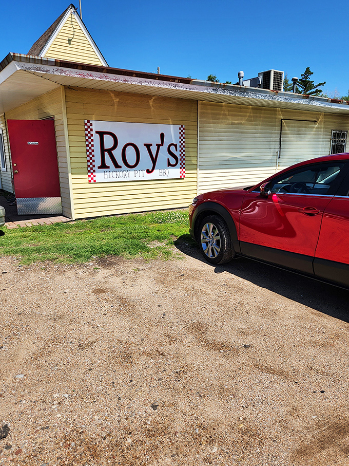The unassuming yellow building with its bright red door stands like a beacon of barbecue hope on Hutchinson's West 4th Avenue.