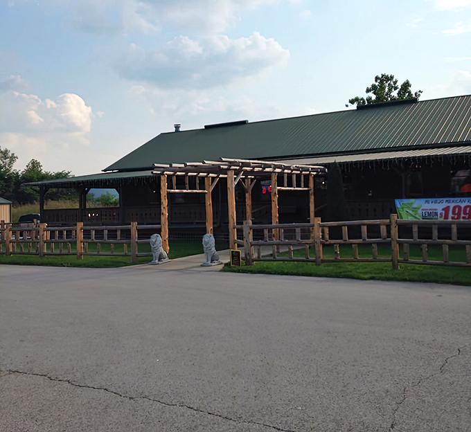 The rustic wooden exterior of Mi Viejo Carrollton welcomes you like an old friend, complete with a charming pergola entrance that practically whispers "come hungry."