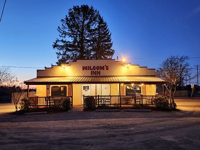 The unassuming exterior of Wilcom's Inn proves once again that culinary treasures often hide behind modest facades. That burgundy railing practically whispers, "Come on in, hungry traveler."