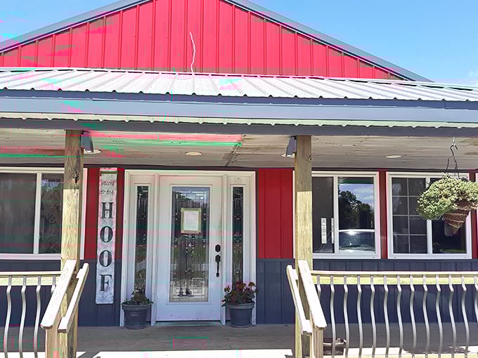 The iconic red exterior of The Hoof glows like a beacon at dusk, promising carnivorous delights within its barn-inspired walls.