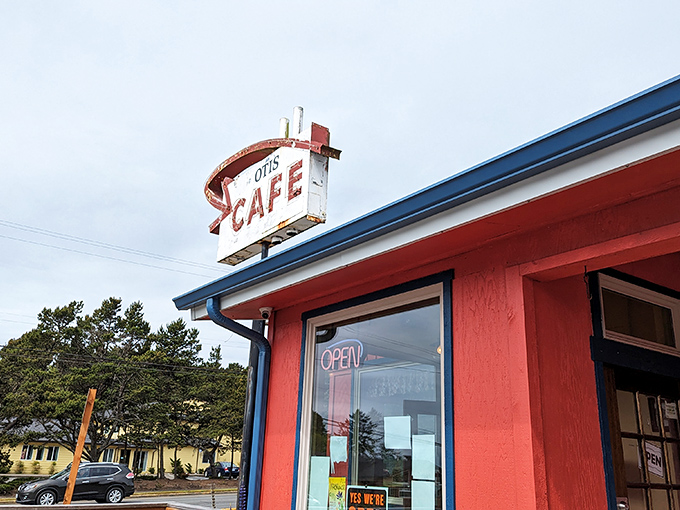 The iconic red exterior and vintage neon sign of Otis Cafe stands like a beacon for hungry travelers. This roadside gem has been calling breakfast pilgrims to Highway 18 for generations.