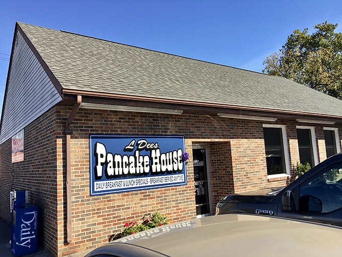 The unassuming brick exterior of L'Dees Pancake House, where the retro signage signals you've found a true local treasure. 